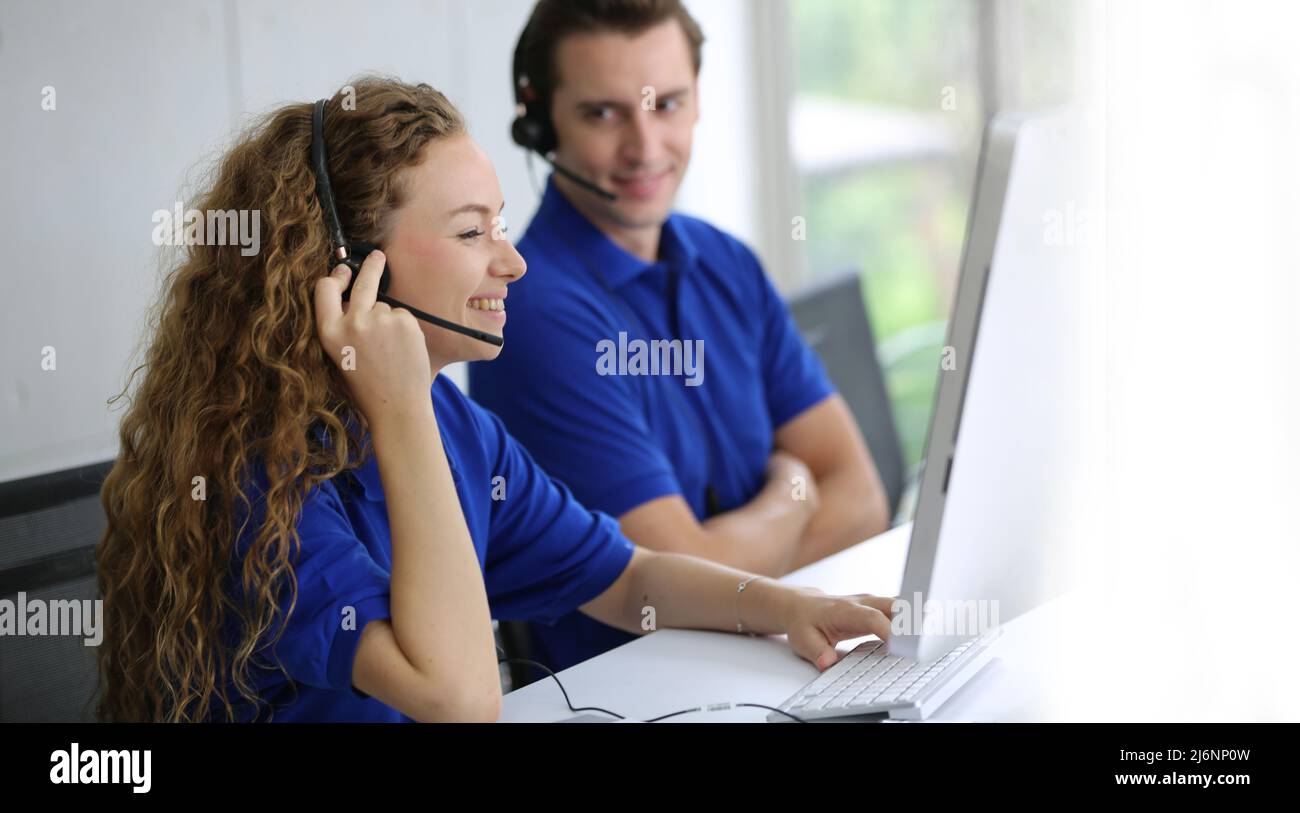 View Of Staff In Busy Customer Service Department Stock Photo - Alamy