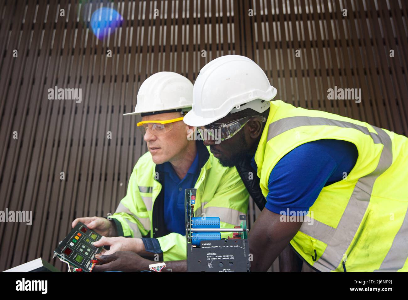 The factory engineer configures a complex production plant Stock Photo ...