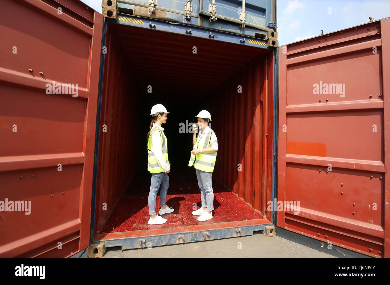 Foreman control Industrial Container Cargo freight ship at industry ...