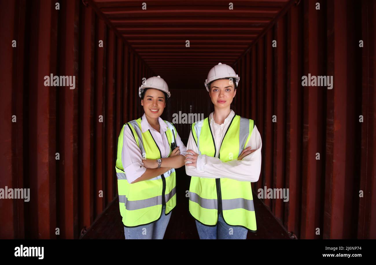 Foreman control Industrial Container Cargo freight ship at industry ...