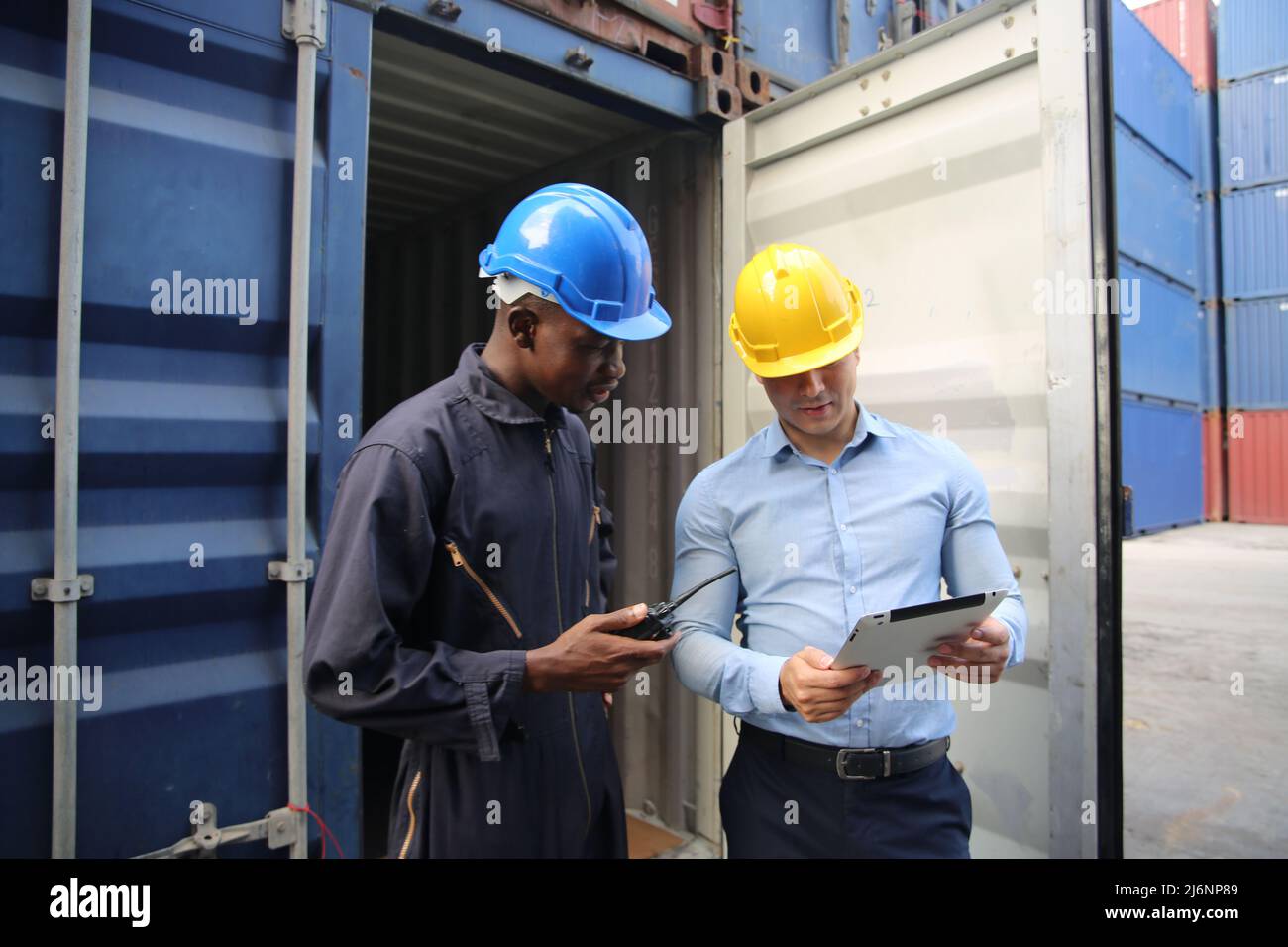 Foreman control Industrial Container Cargo freight ship at industry ...