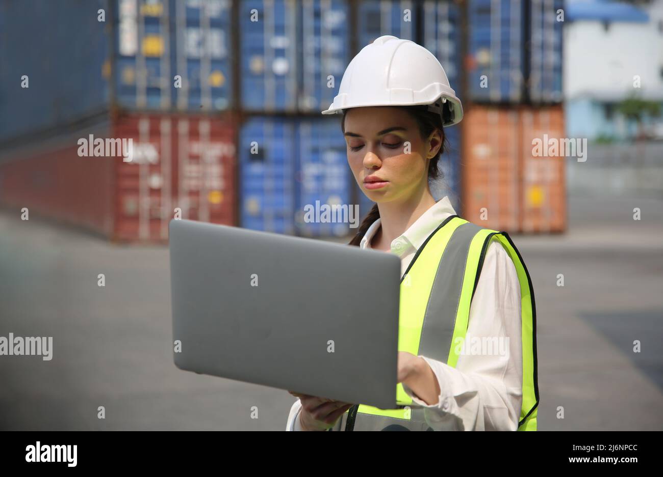 Foreman control Industrial Container Cargo freight ship at industry ...