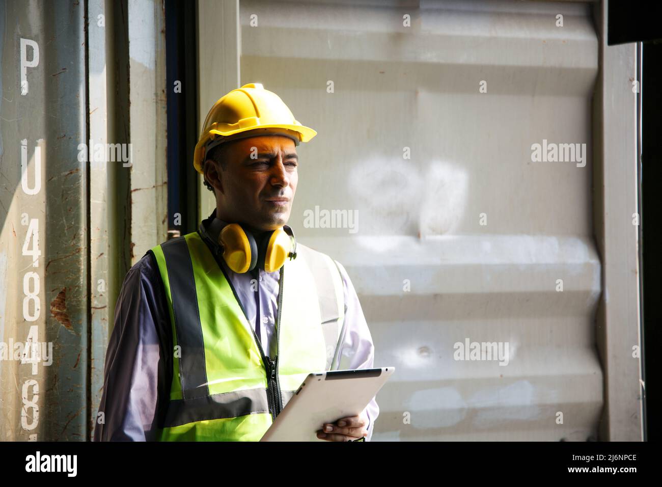 Foreman control Industrial Container Cargo freight ship at industry ...