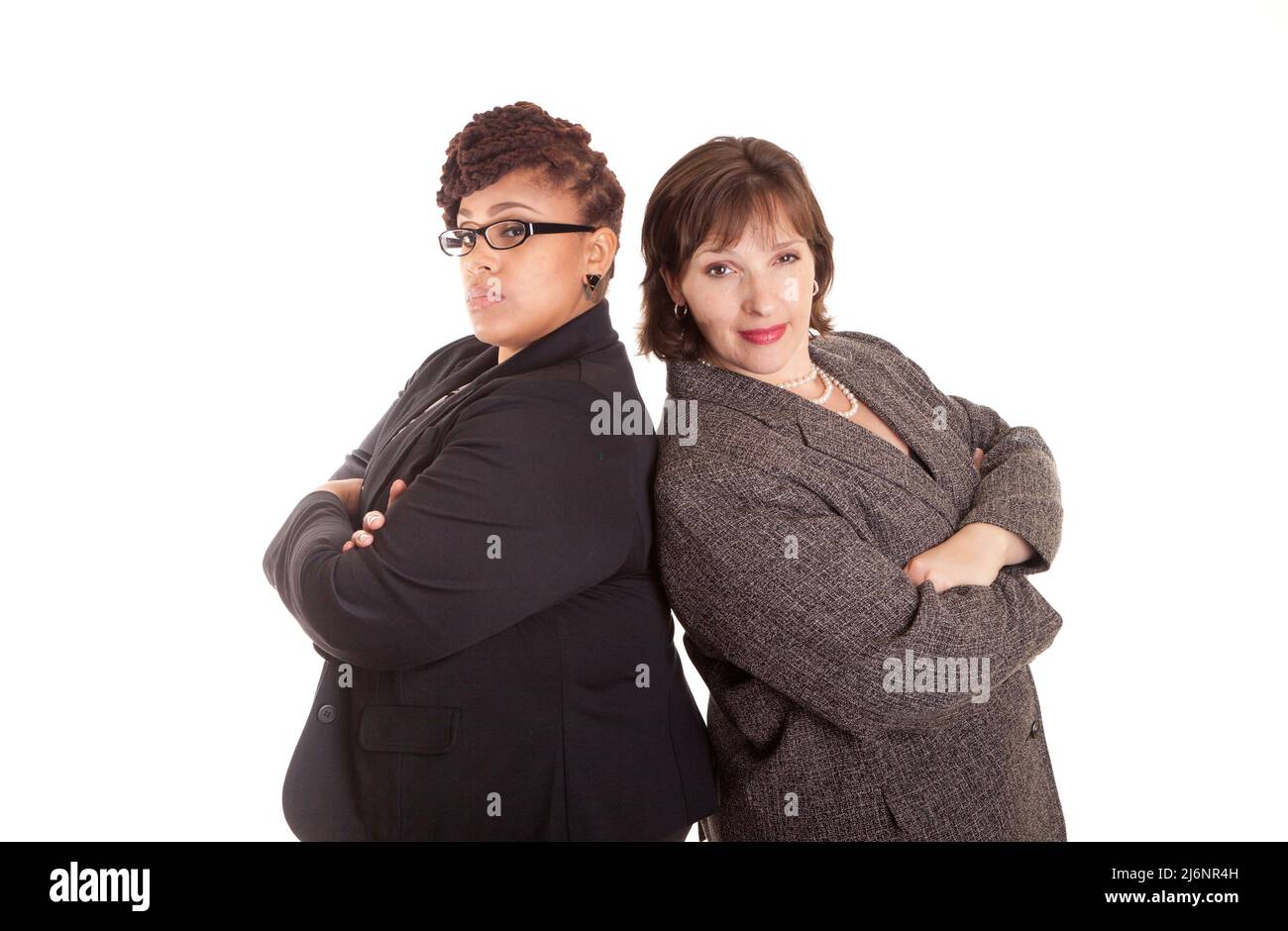 Two confident plus size mixed race business women on a white background ...