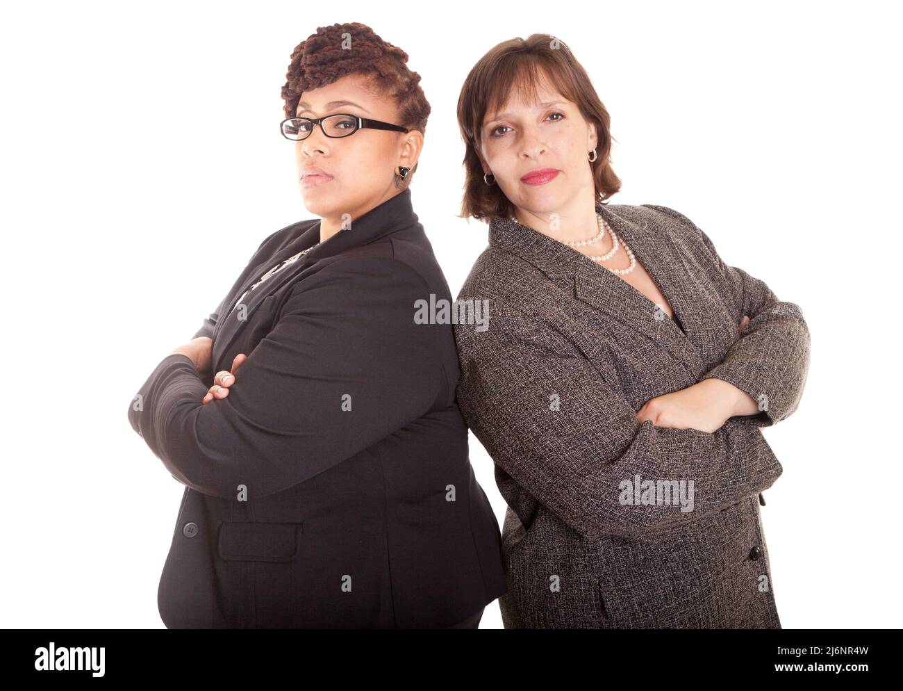 Two confident plus size mixed race business women on a white background ...