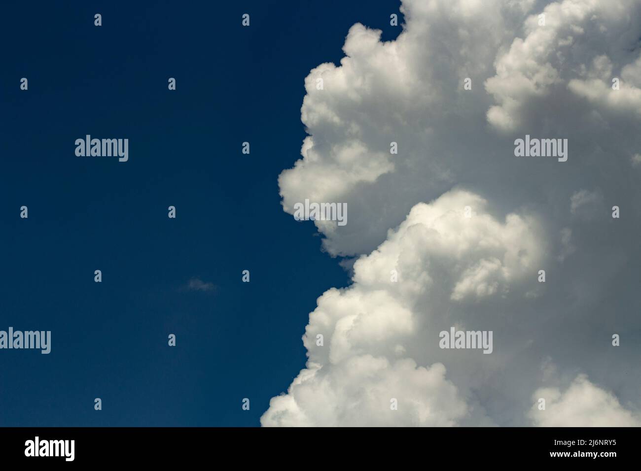 Cumulus. White summer clouds in the sky. Summer weather in the middle ...