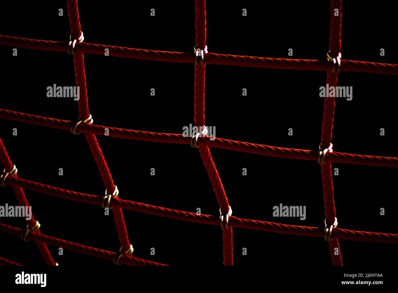 Ropes in the playground. Climbing net, shot close-up. Ropes fastened ...