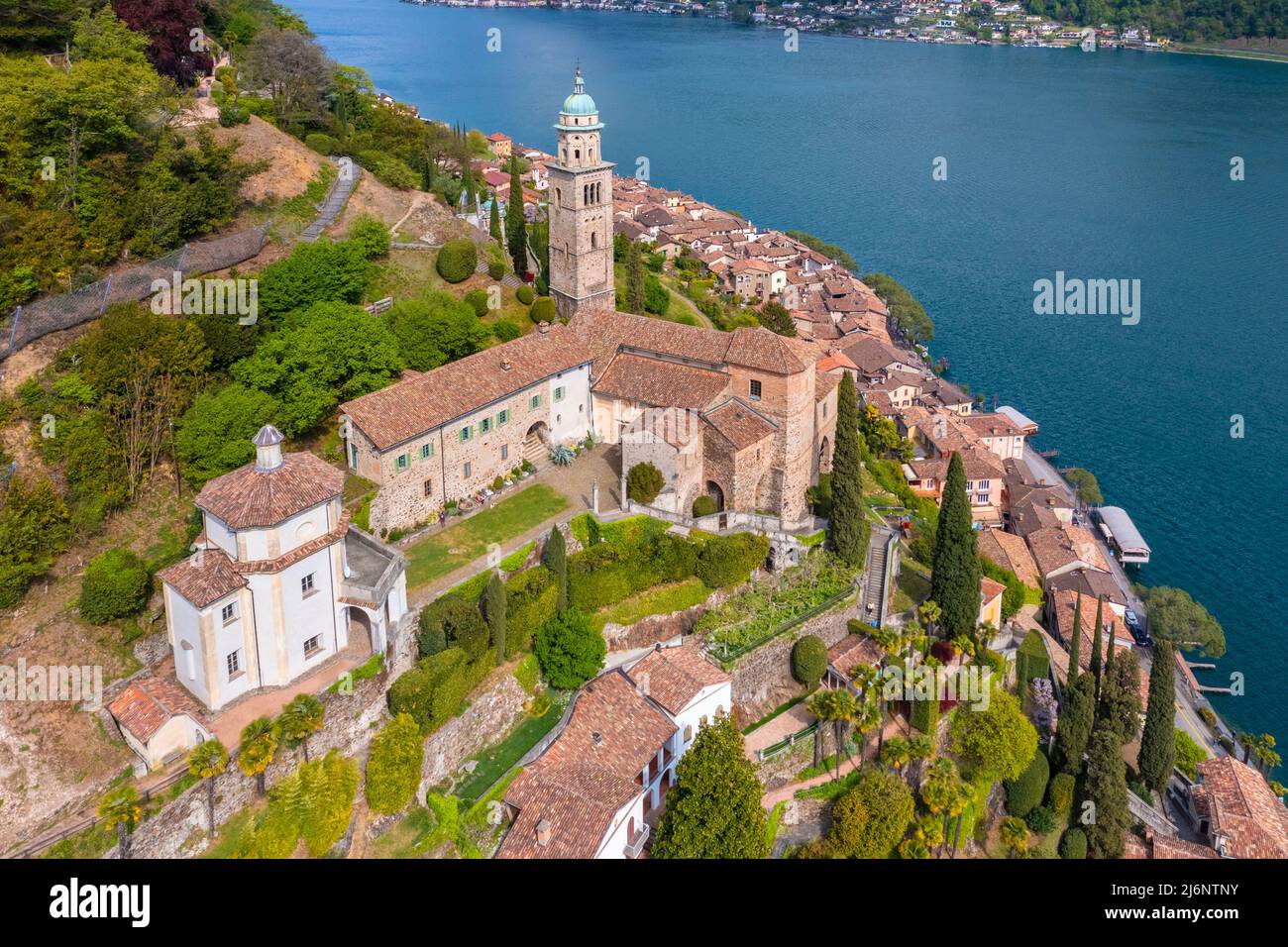 Aerial view of the small swiss village of Morcote and the church of ...