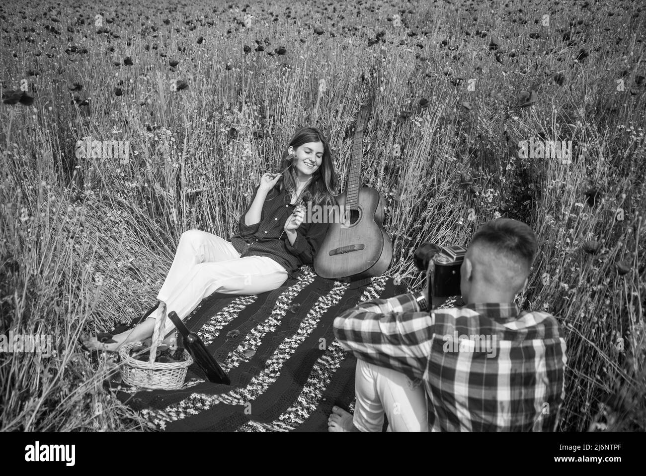 romantic couple among poppies. love and romance. opium. spring ...