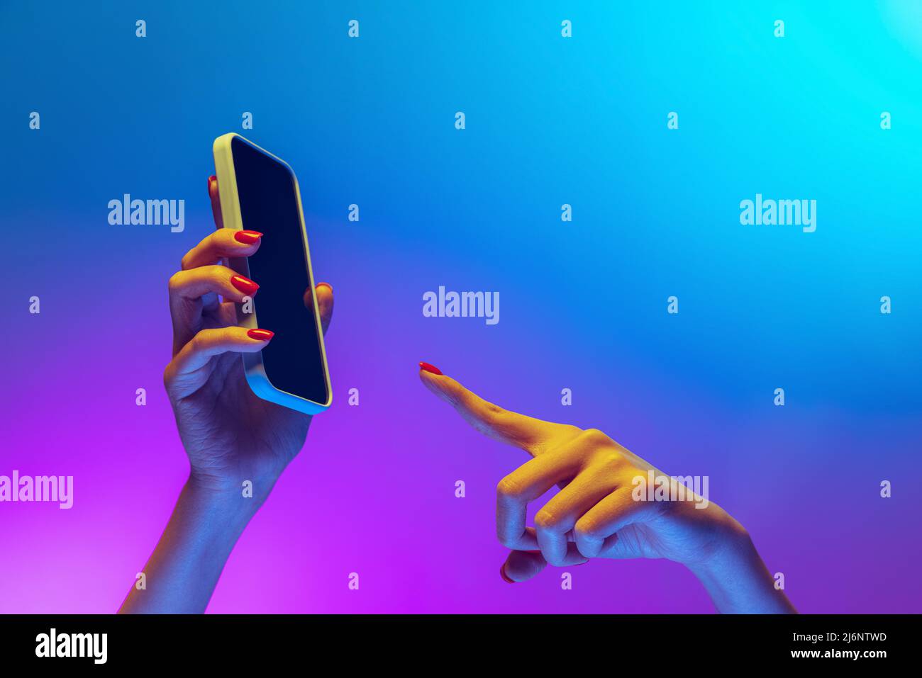 Closeup female hands holding gadget, smartphone isolated on gradient ...