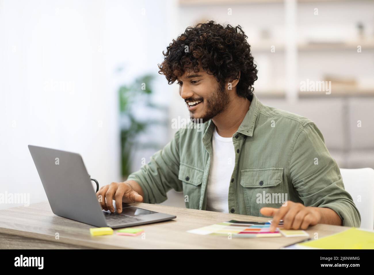 Happy guy working laptop hi-res stock photography and images - Alamy