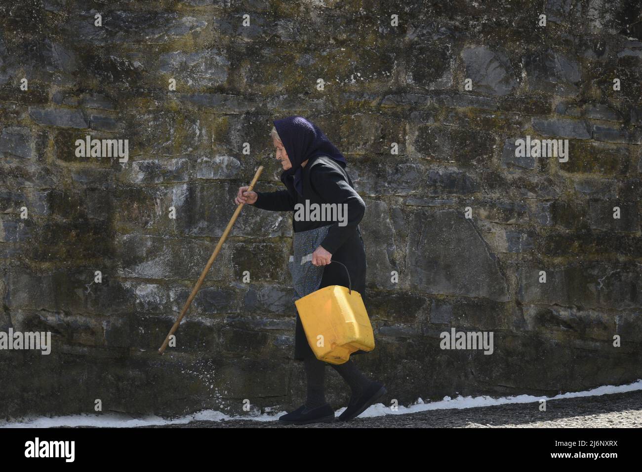 Landscape with view of a local centenarian peasant woman in the ...