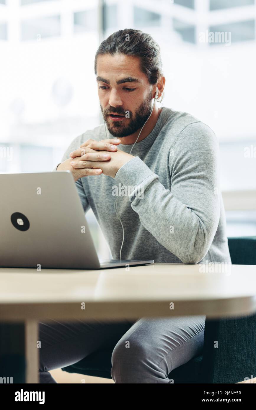 Modern businessman having a discussion with his associates during an ...