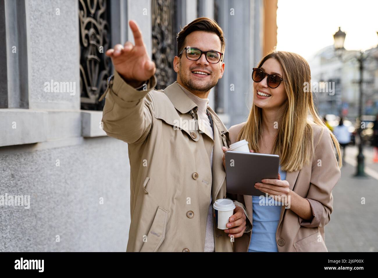Happy successful business couple in love having fun together in urban ...