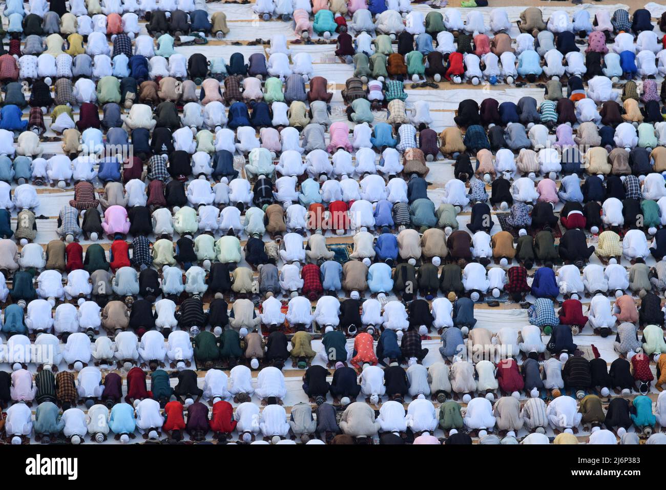 Muslim Devotees offer Eid-al-Fitr Prayers at a ground to mark the end ...