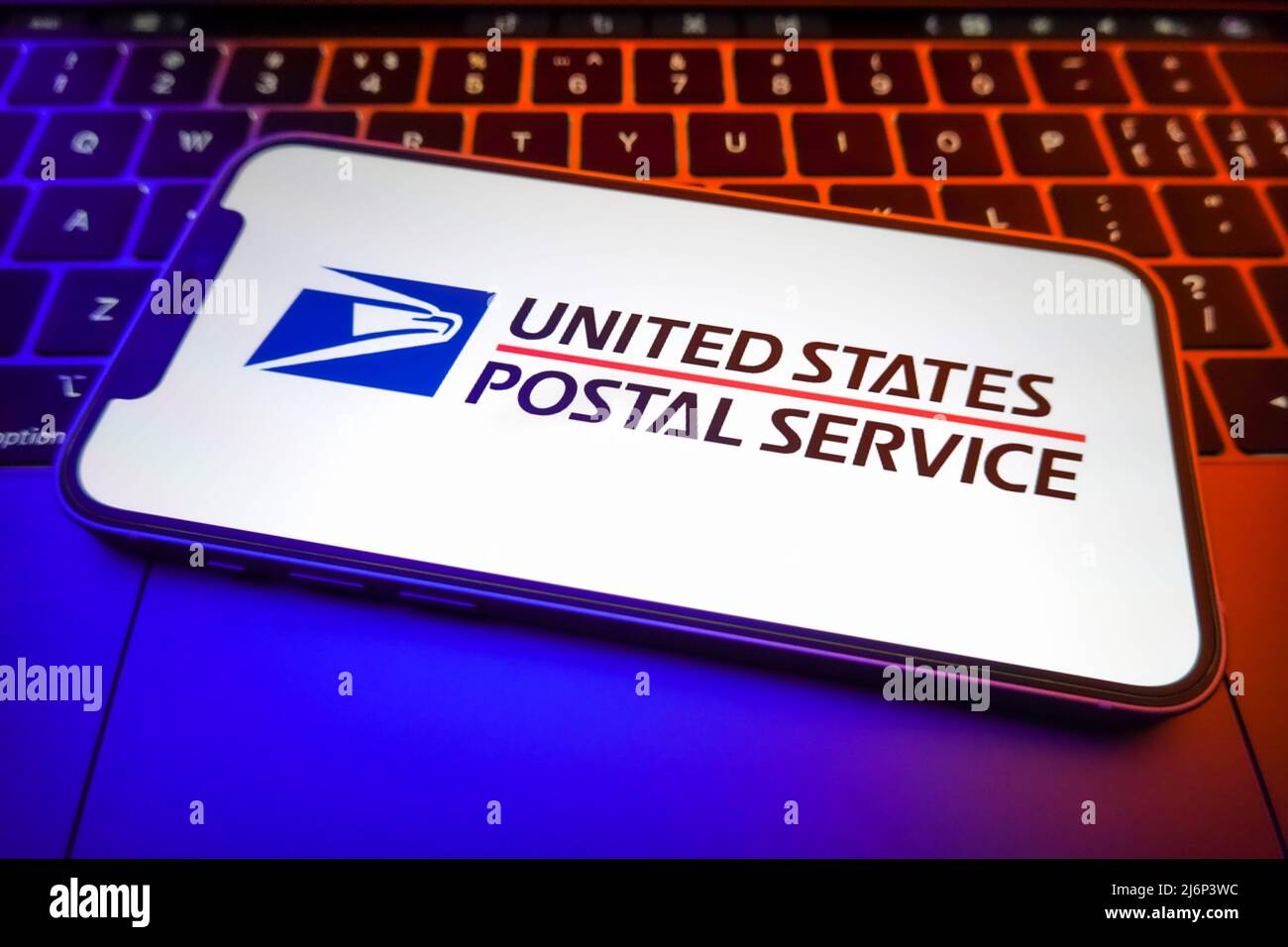 In this photo illustration, U.S. Postal Service logo is displayed on a ...