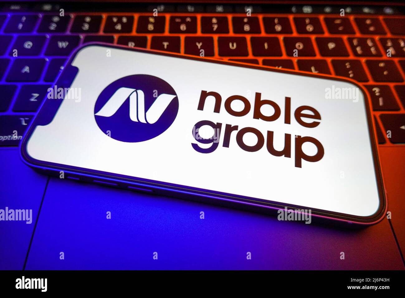 In this photo illustration, a Noble Group logo is displayed on the ...