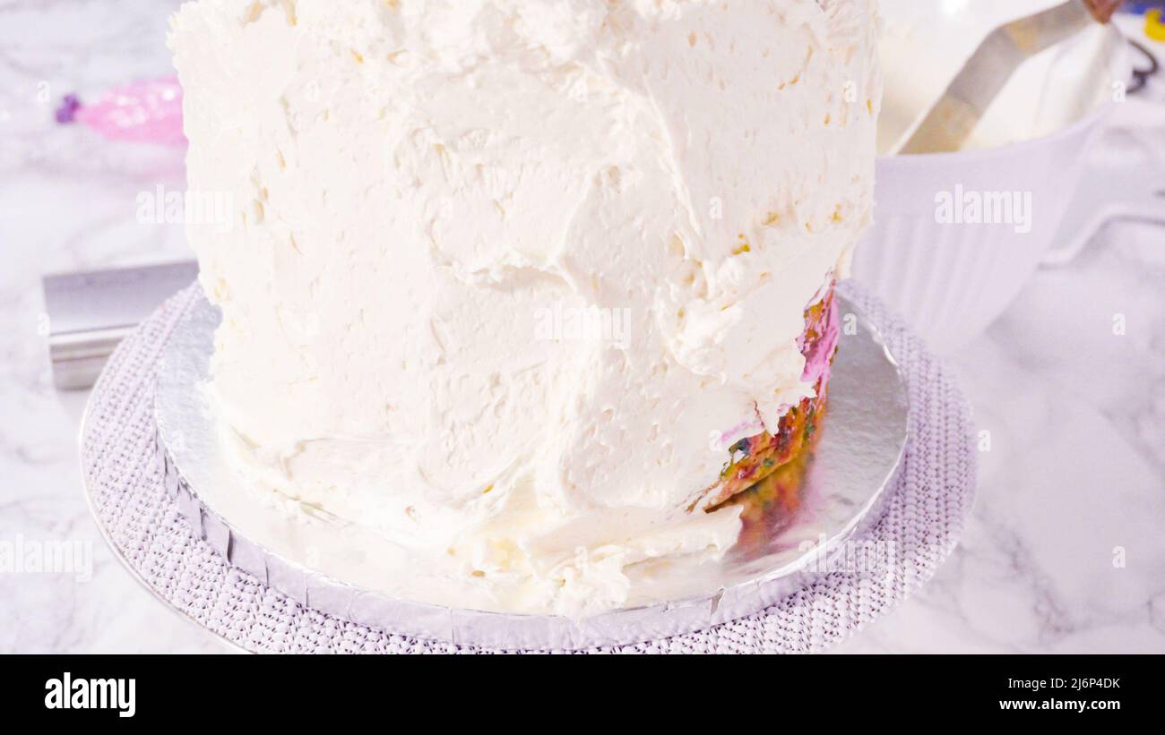 Step by step. Frosting round funfetti cake with white italian ...