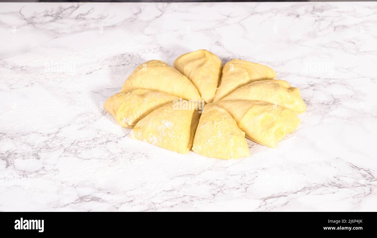 Step by step. Dividing bread dough to bake homemade brioche buns Stock ...