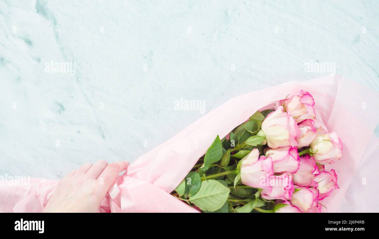 Flat lay. Step by step. Bouquet of pink roses on a concrete background ...