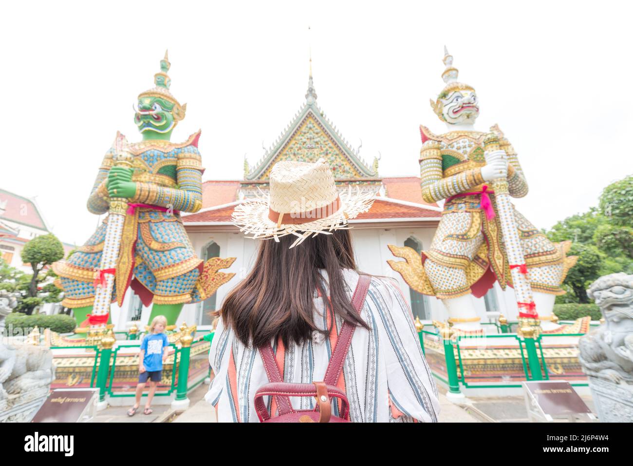 Asian girl tourist smiling while visiting Wat Arun or Temple of Dawn ...