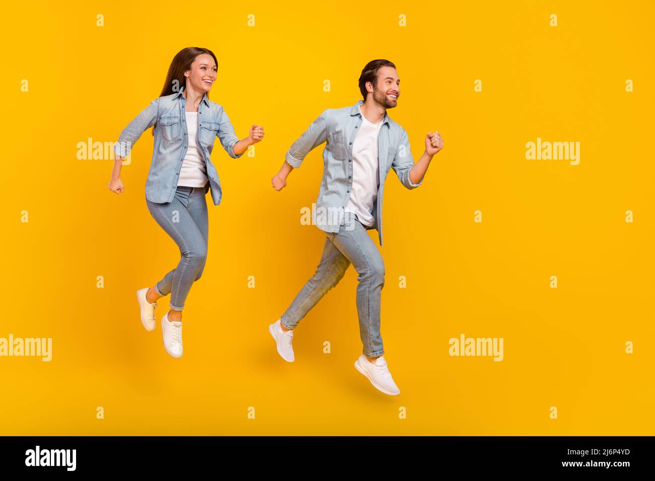 Full length body size view of beautiful handsome cheery people jumping ...