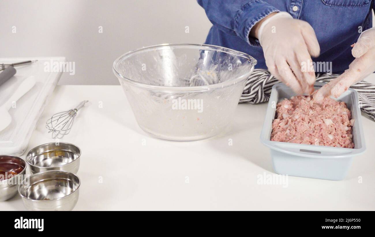 Step by step. Mixing ingredients for a classic beef meatloaf recipe in ...