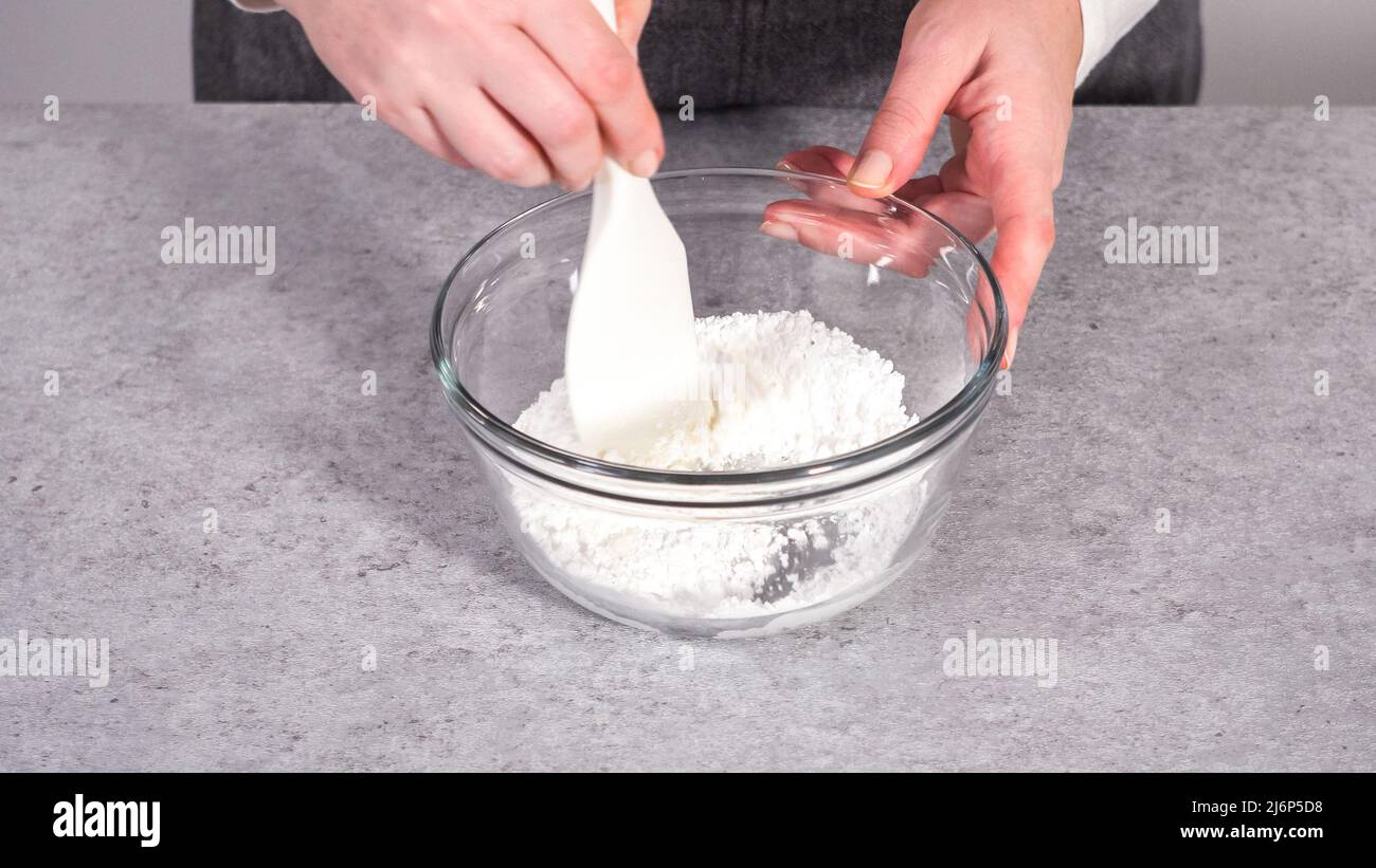 Step by step. Mixing ingredients in a glass mixing bowl to prepare the ...