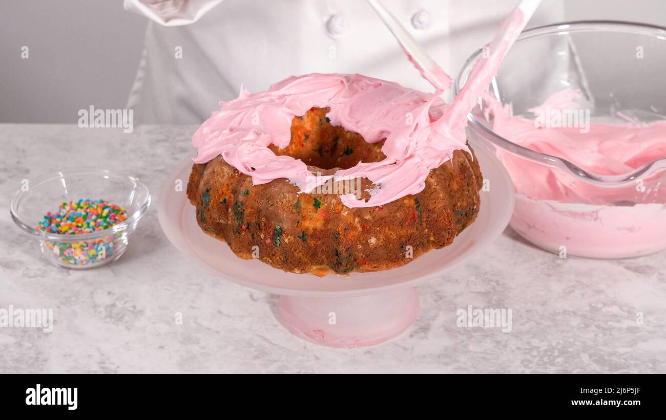 Step by step. Frosting funfetti bunt cake with pink buttercream icing ...