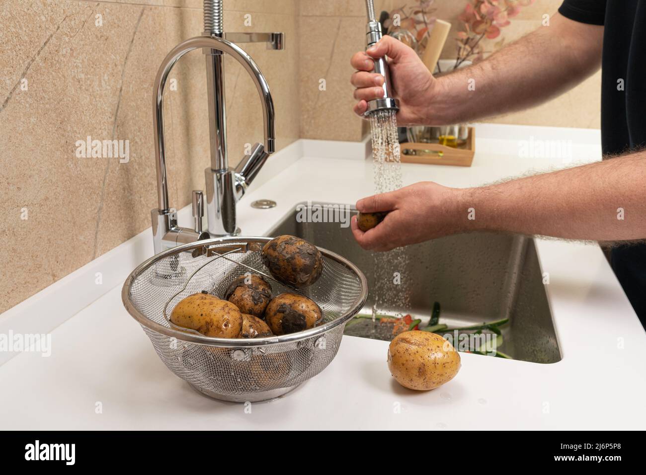 Washing potatoes in water hi-res stock photography and images - Alamy