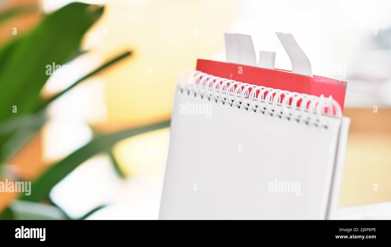 spiral notepad and book with bookmarks in living room, close up view ...