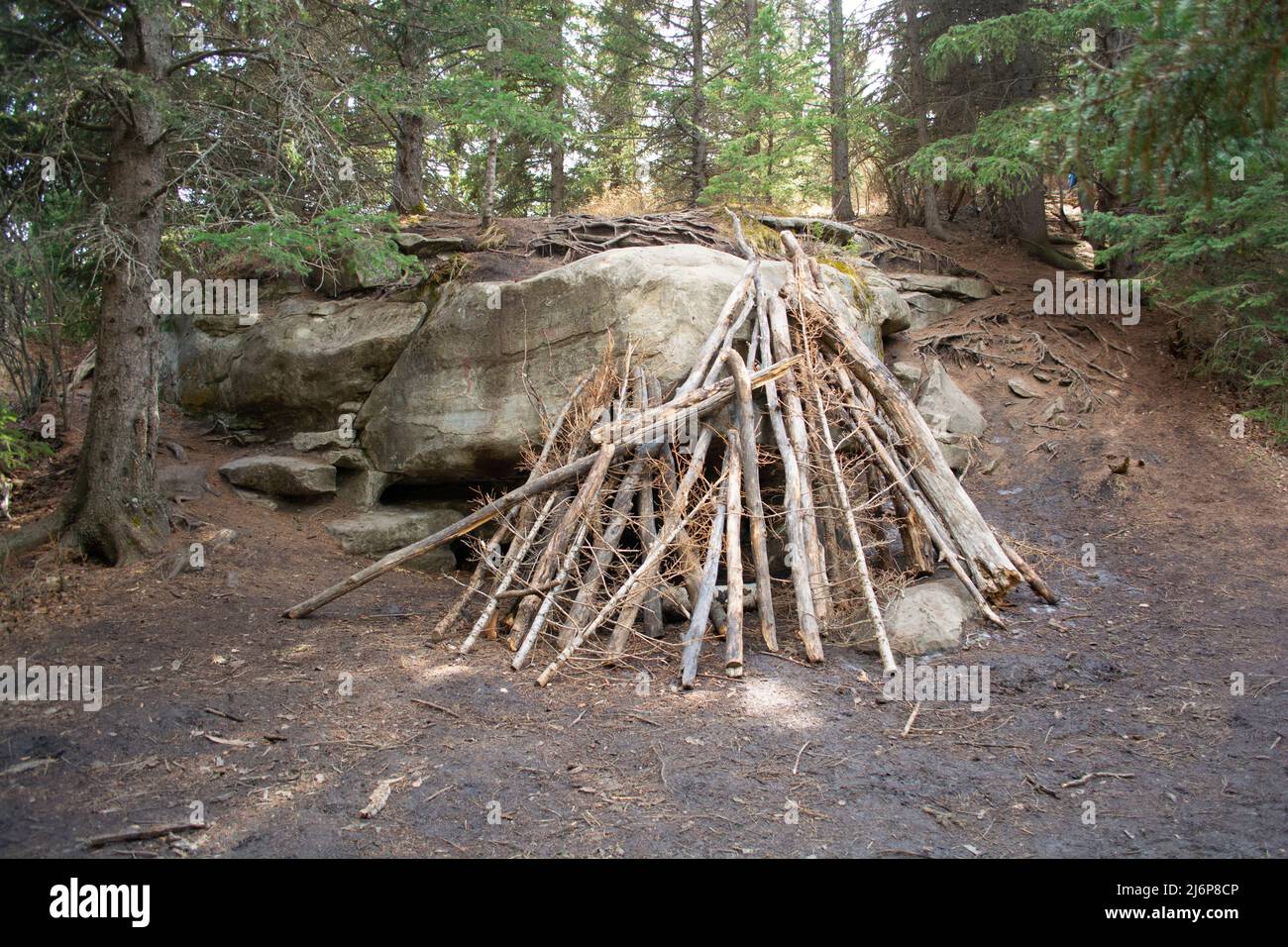 Lean-to Wood Shelter on Overhanging Rock Cave Stock Photo - Alamy