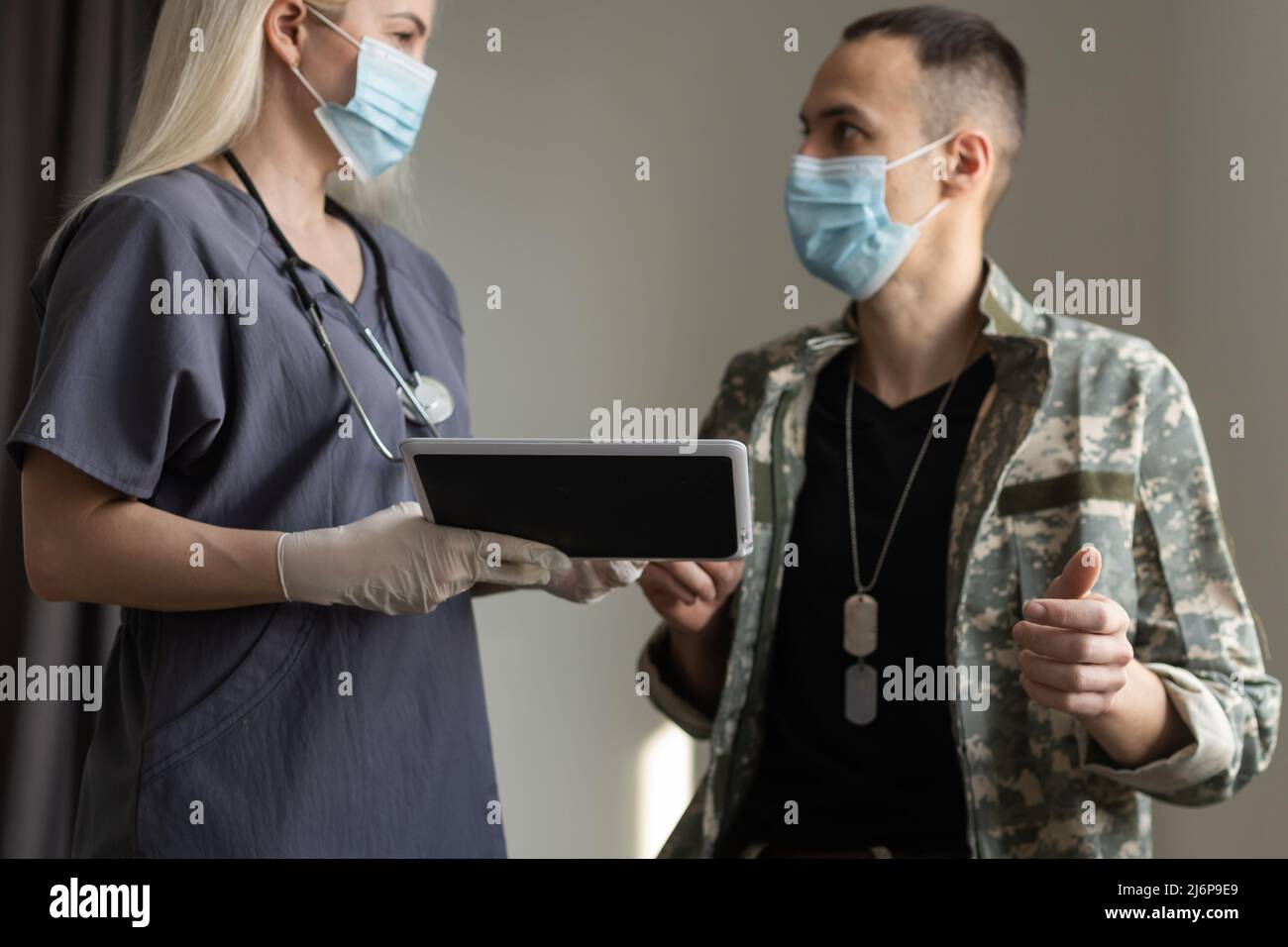 medical worker with military officer patient in hospital Stock Photo ...
