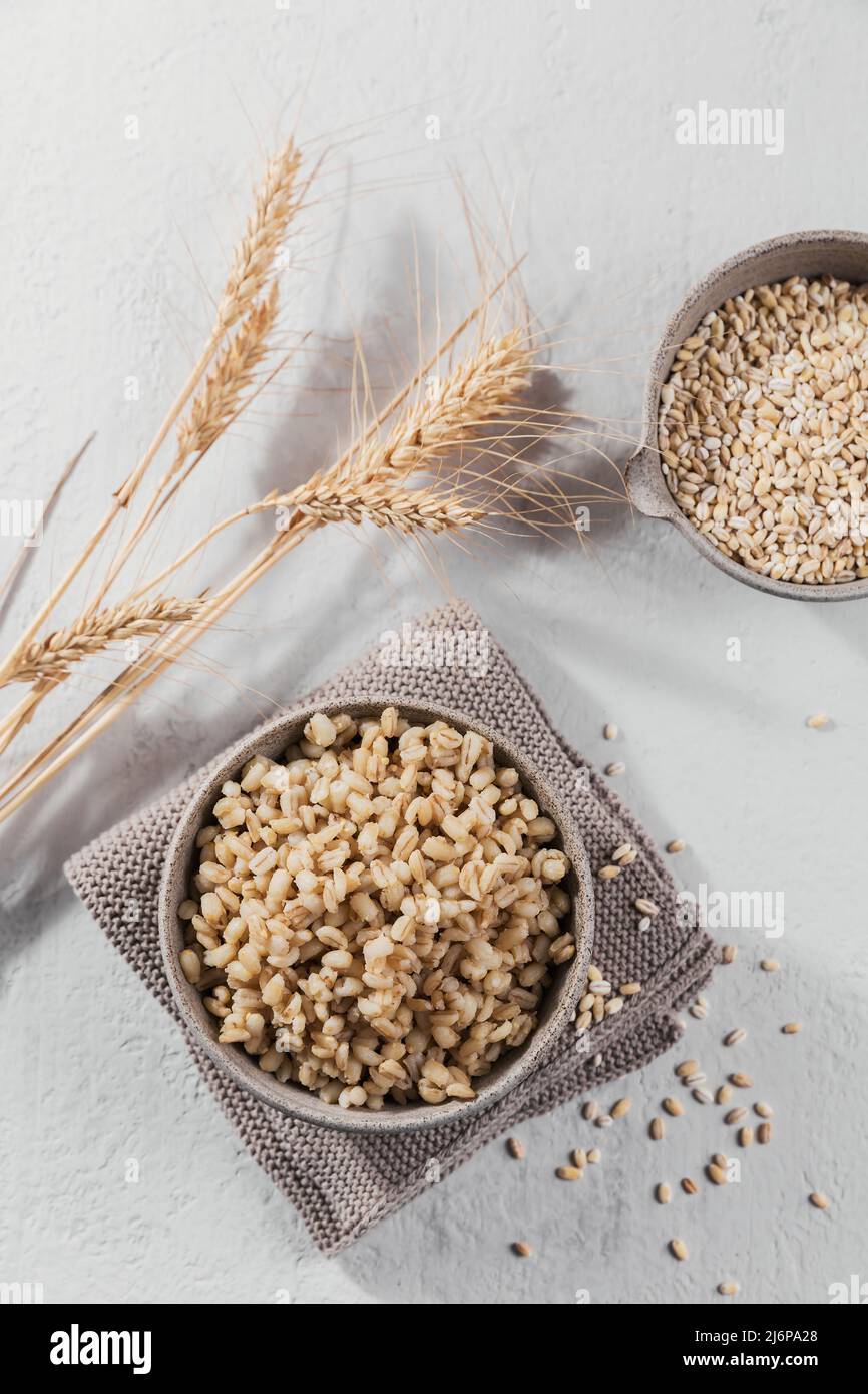Bowl of cooked peeled barley grains porridge Stock Photo - Alamy