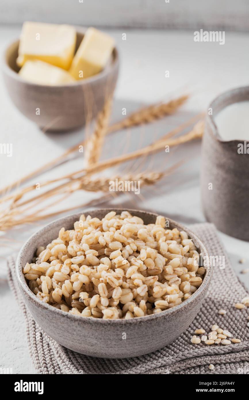 Bowl of cooked peeled barley grains porridge Stock Photo - Alamy