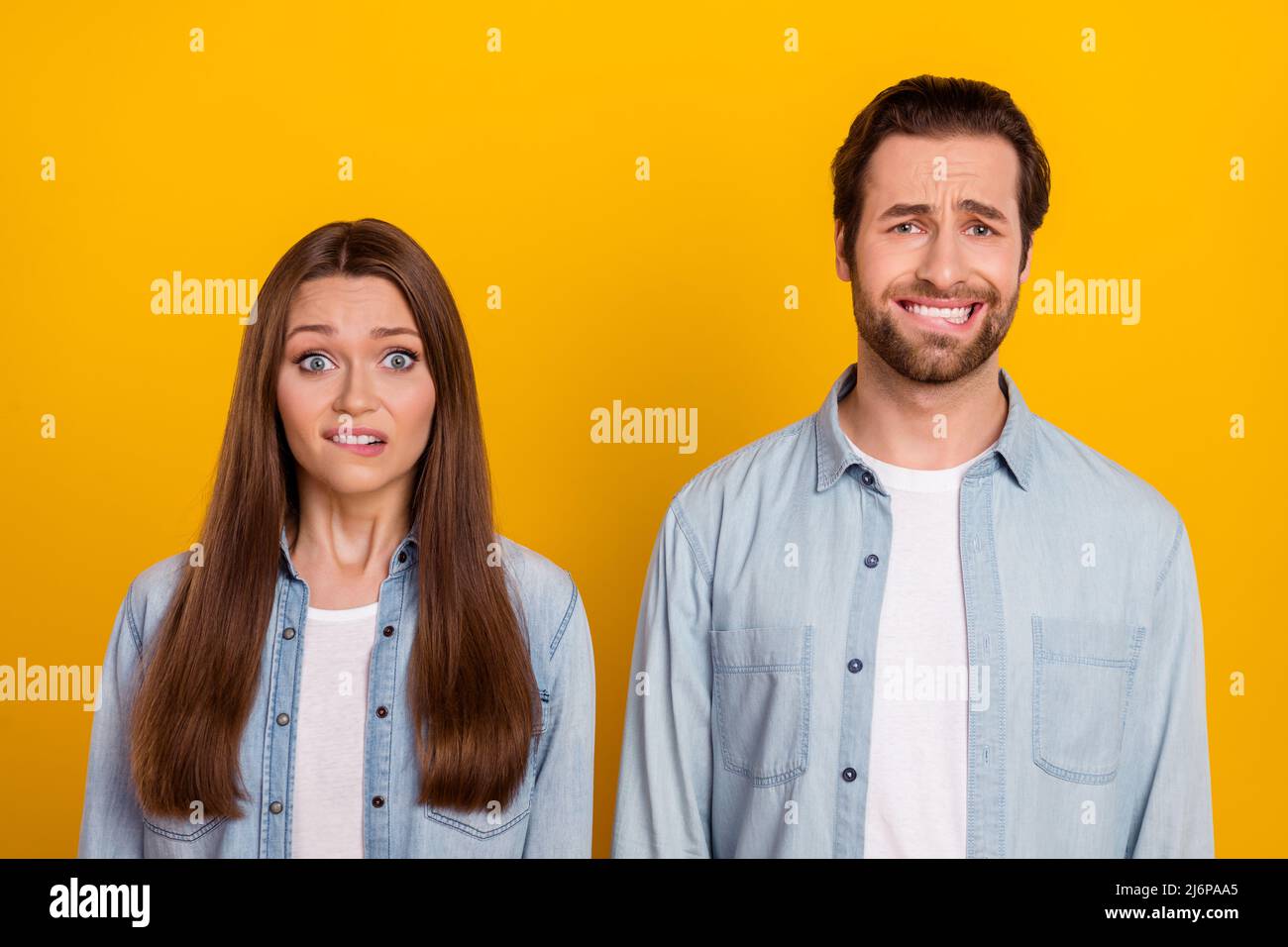 Photo of doubtful unsure husband wife wear jeans shirts biting lips ...