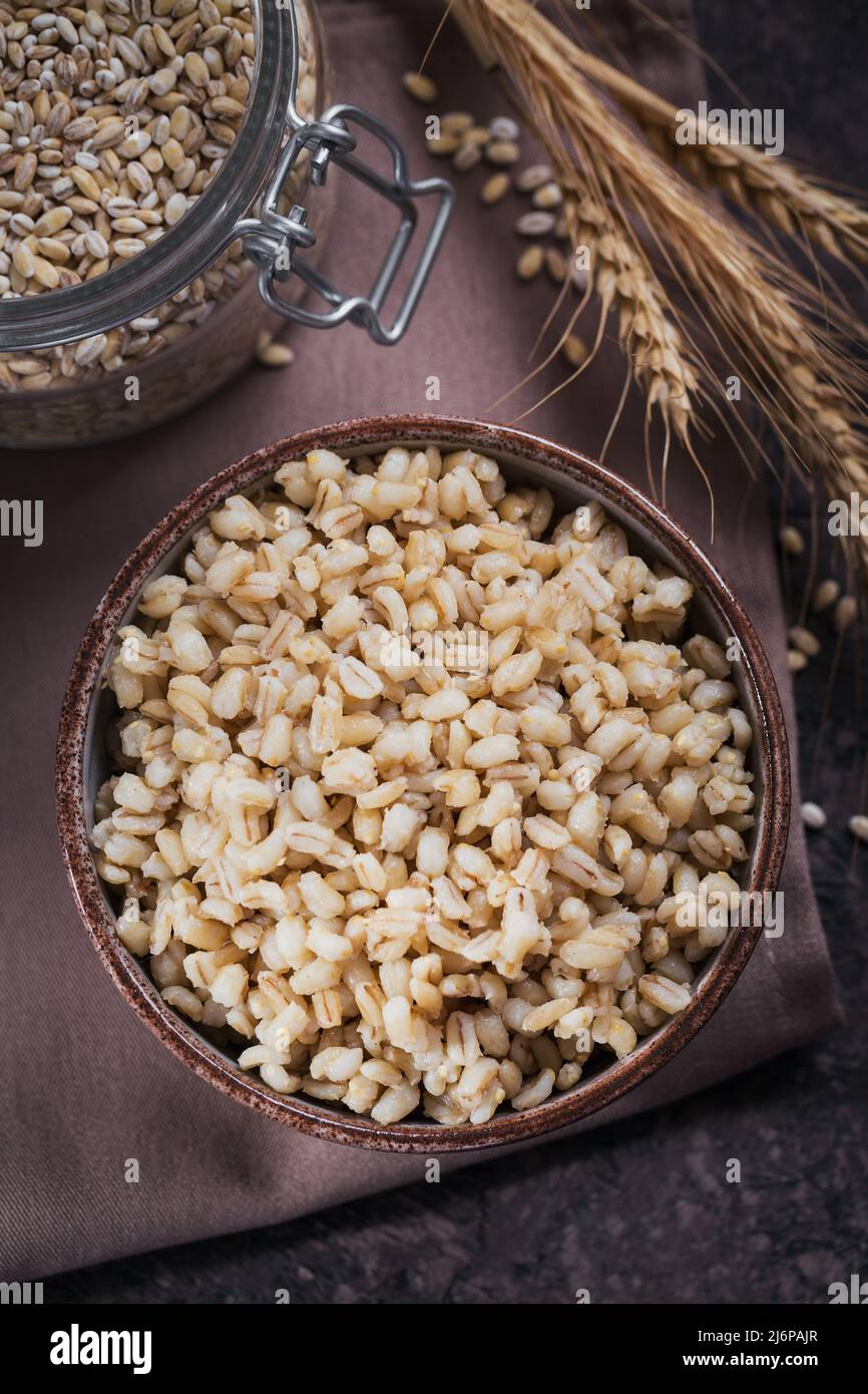 Bowl of cooked peeled barley grains porridge Stock Photo - Alamy