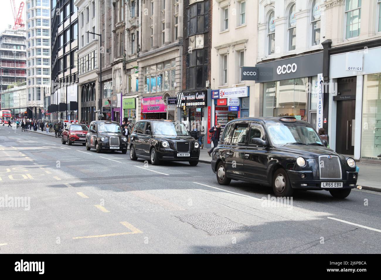 Black cab taxis on Oxford Street West End, London, England, UK, 2022 ...