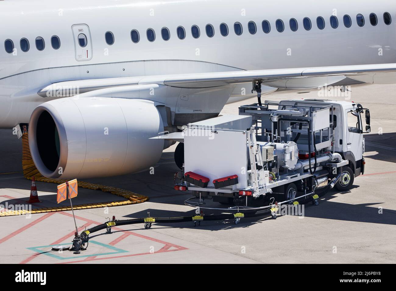 Refueling of airplane at airport. Ground service before flight Stock ...