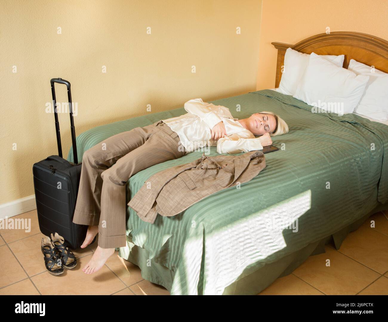 Woman passed out on bed hi-res stock photography and images - Alamy