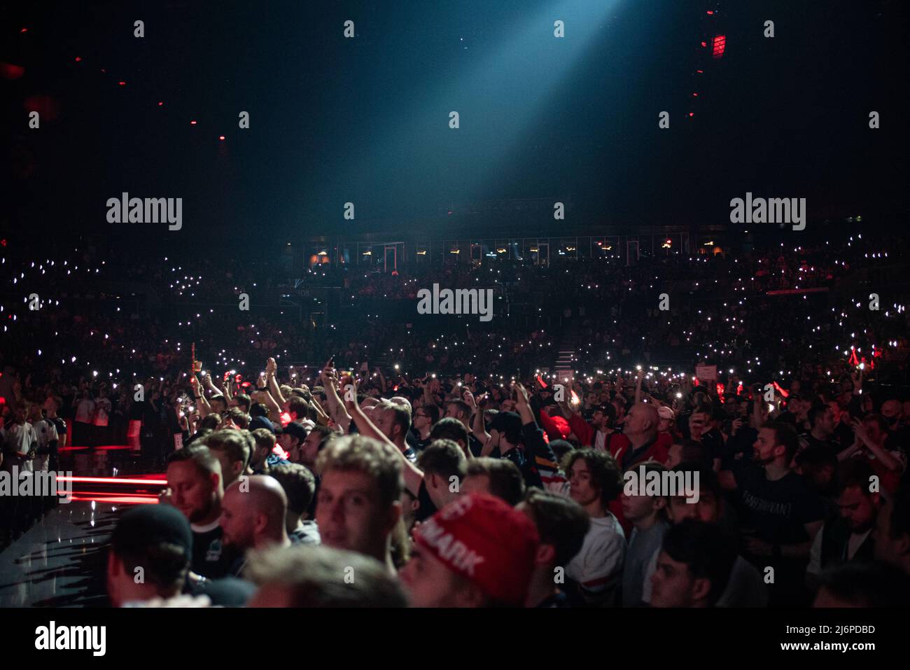 a crowd shot of the arena ligted up by phone flashlights Stock Photo ...