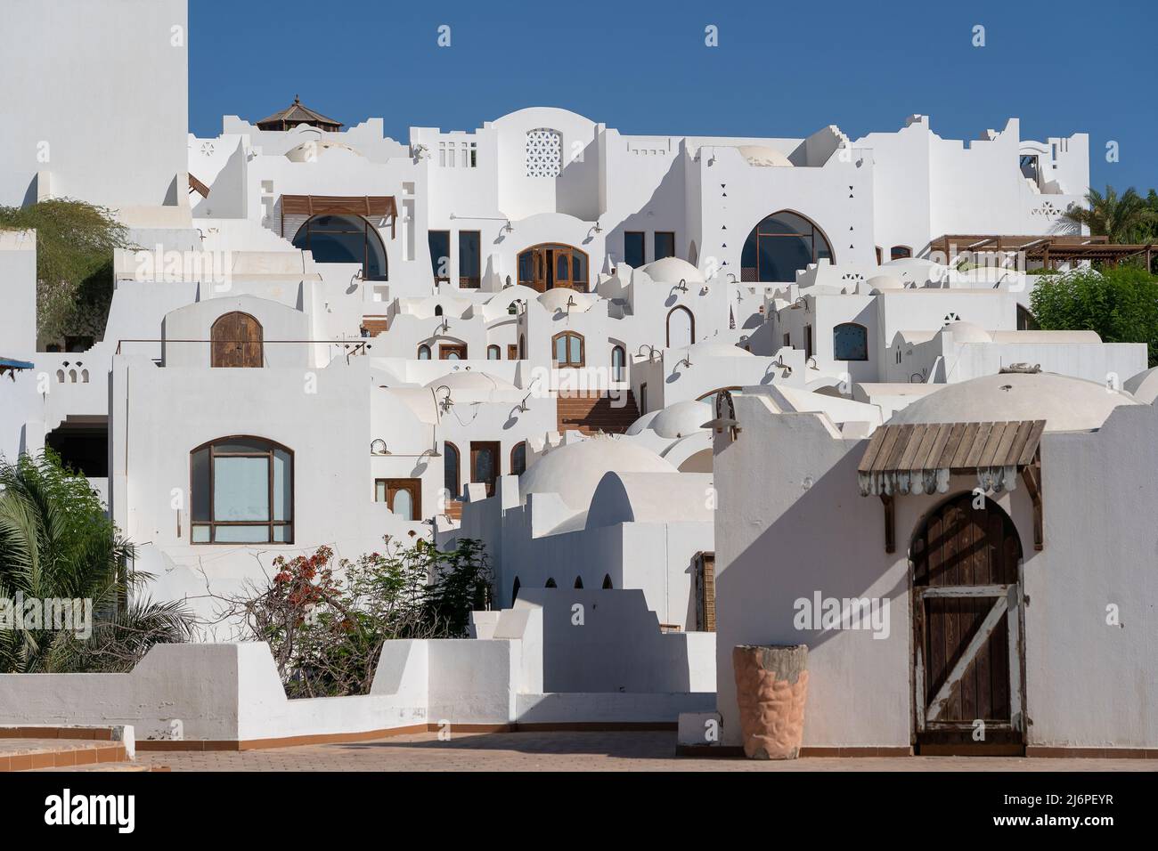 White wall buildings and stairs on the street in resort town Sharm El ...