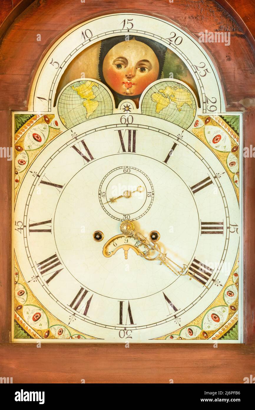 Authentic ancient clock with moon and star rotation in a wooden casing ...