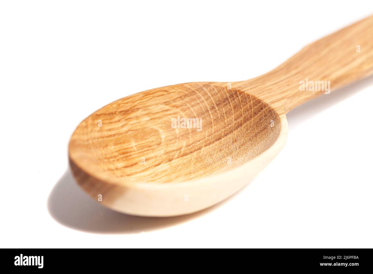 Empty wooden spoon made of oak. Natural kitchenware Stock Photo - Alamy