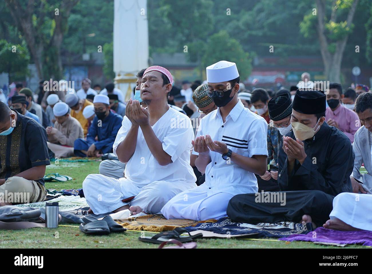 Indonesian Muslims attend Eid al-Fitr prayers at the start of the ...