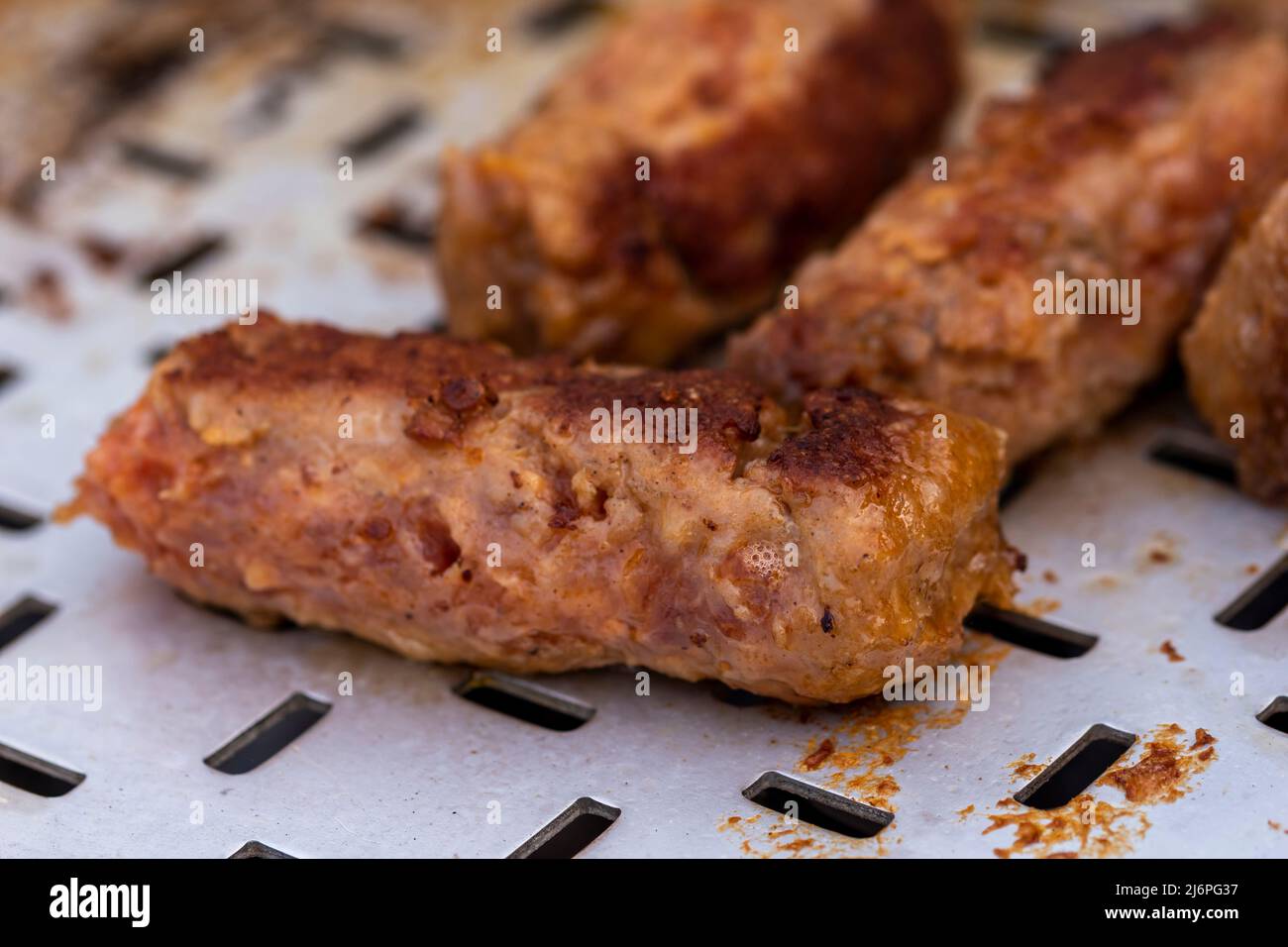 Traditional Romanian food called "mici" which consist of pork meat ...
