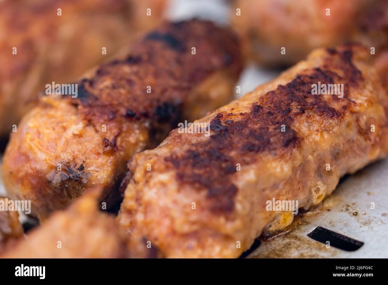 Traditional Romanian food called "mici" which consist of pork meat ...