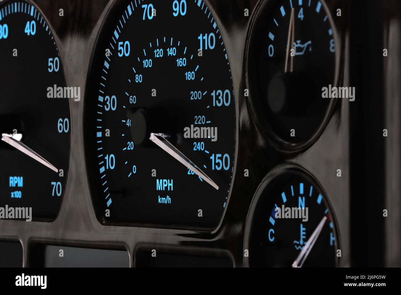speedometer in car dashboard at full speed in illuminated night mode ...