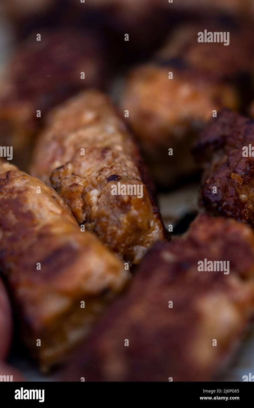 Traditional Romanian food called "mici" which consist of pork meat ...