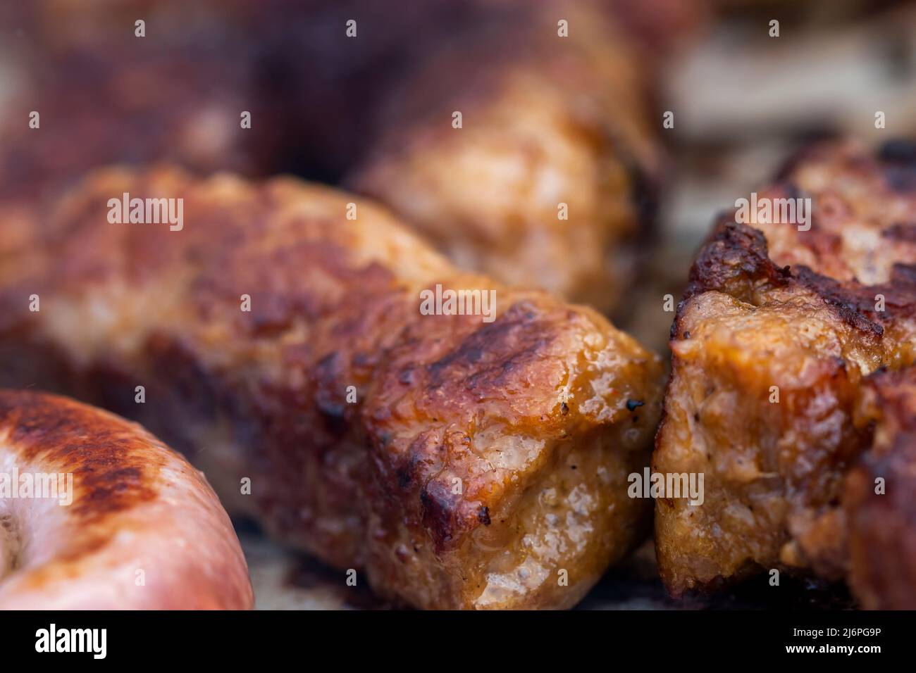 Traditional Romanian food called "mici" which consist of pork meat ...